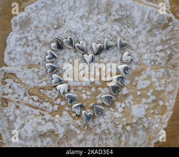 Paper hearts on brown background, close up Stock Photo - Alamy