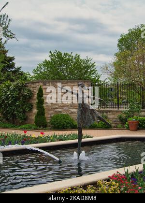 A vertical shot of a dancing lady sculpture in a Muriel Kauffman ...