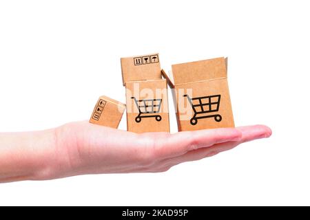 Miniature delivery packages labeled with shipping symbols placed on ...