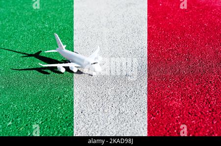 Toy airplane placed on the road painted the colors of the national flag ...