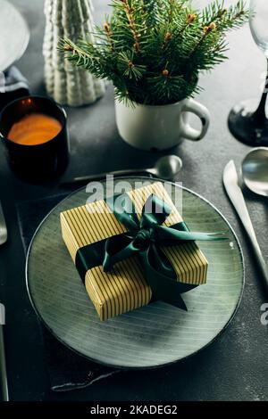 Gift box in silver spoon on yellow background Stock Photo - Alamy