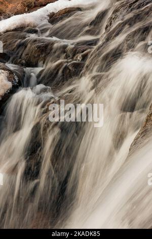 Close-up detail of the cascades of Faux Falls with ice and snow in ...