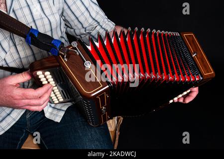 Irish 3 row button accordion being played Stock Photo - Alamy