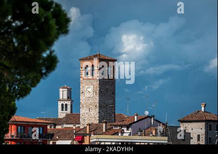 Towards the sunset. Marano lagoon late summer colors. Clouds and sun ...