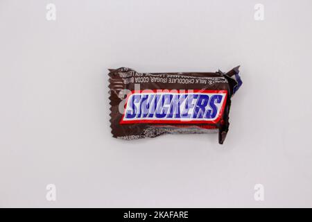 SNICKERS chocolate bar isolated on white background. Snickers is a ...