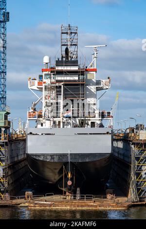 general cargo vessel in floating dock for maintenance at night Stock ...