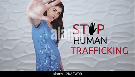 Composite of stop human trafficking text and caucasian woman showing ...