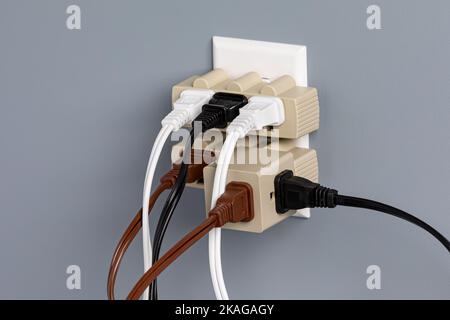 Overloaded electrical outlet Stock Photo - Alamy
