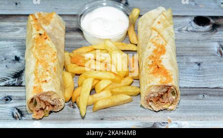 Syrian recipe cuisine background, chicken shawerma or shawarma tortilla ...