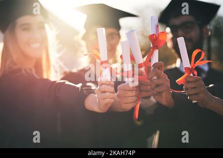 Group of people students graduated holding diploma at university campus ...
