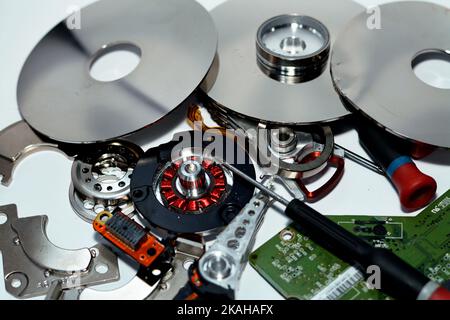 Damaged Hard disk drive components with disks, read write head, spindle ...