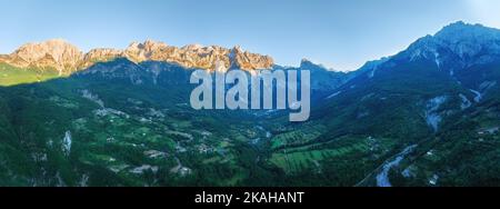 A panoramic, aerial view of the Theth valley during sunset. Hiking ...