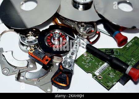 Damaged Hard disk drive components with disks, read write head, spindle ...