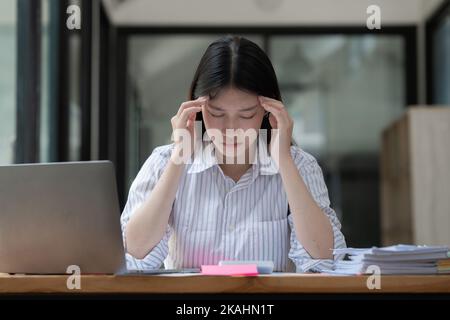 Asian business woman worry about marketing plan of this years. Account ...
