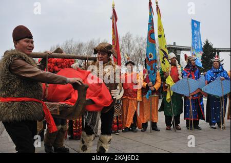 People perform Shaman Dance to pray at the opening of the Kaijiang ...