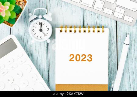 2023 Desk calender with alarm clock, keyboard computer, pen, plant pot ...