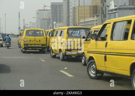 Commercial Yellow Buses, popularly known as Danfo, at Iyana-Ipaja park ...
