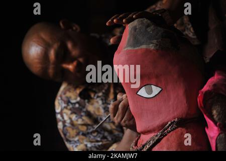 GHAMBIR NEKHU, 46 yrs old, priest painting on Statue of Idol Rato ...