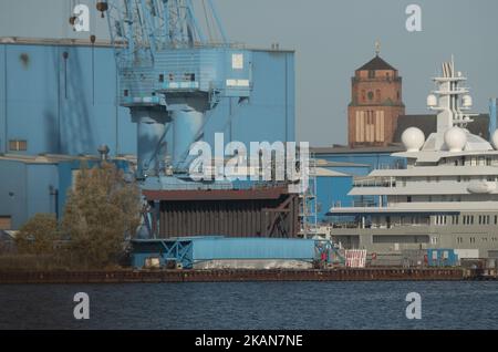 Wolgast, Germany. 03rd Nov, 2022. Shipyard workers lay a foundation ...