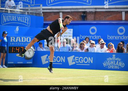 Grigor Dimitrov of Bulgaria plays a shot against David Goffin of ...