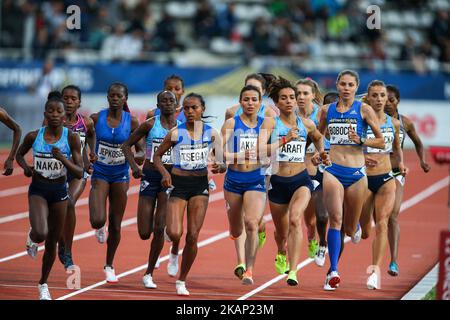 Athletes compete during the women's 1500 meters heat at the World ...