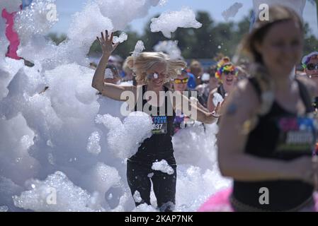 Locals play with foam during the Foam Fest in Toronto, Canada on July ...