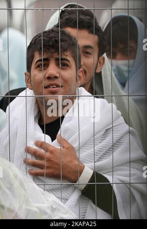 A view of people thought to be migrants inside the Manston immigration ...