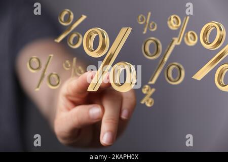 A man touching 3D rendered percentage signs above the tablet screen ...