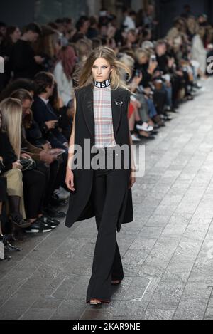 A model walks the runway at the VERSUS show during London Fashion Week ...