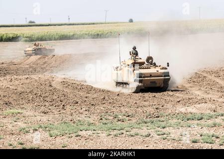 Turkish soldiers with their tanks participate in a military exercise ...