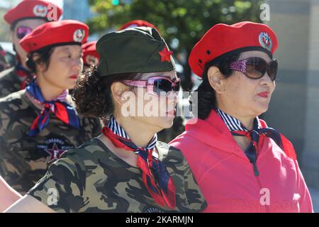 Chinese dancers dressed in military fatigues practice before a ...