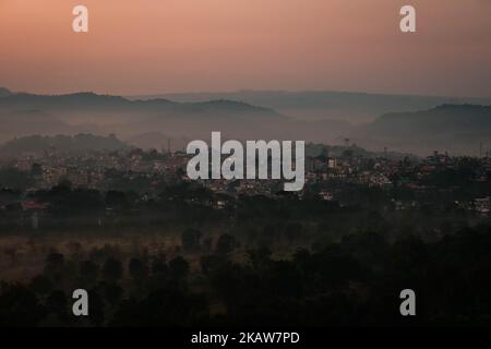 A cityscape view of Hamirpur, Himachal Pradesh with hills at sunset in ...