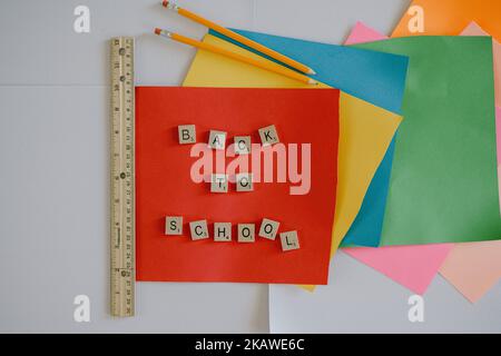 A top view closeup of a ruler, pencils, eraser, cutter, notebook, on ...