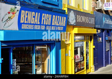 Colourful multicultural shop fronts in Southall Greater London England ...