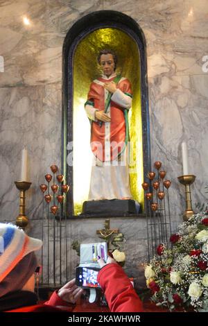 People visit the chapel with the statue of patron saint of love, St ...