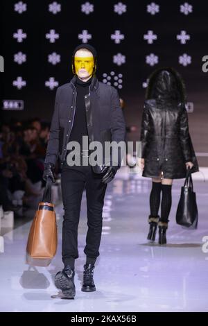 A model walking the runway during CANADA 150 Fashion show on day three ...
