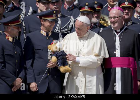 Pope Francis is presented with a teddy Bear ad he meets the band of ...