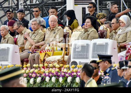 Malaysia's 6th prime minister, Najib Rajak (C) and his wife Rosema ...
