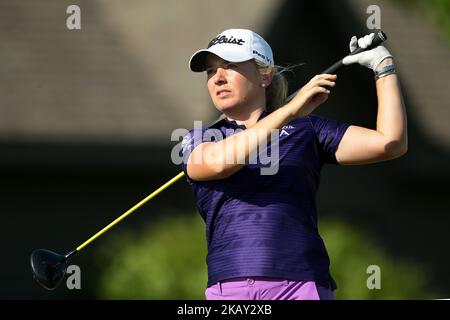 Bronte Law, of England, tees off on the first hole during the first ...