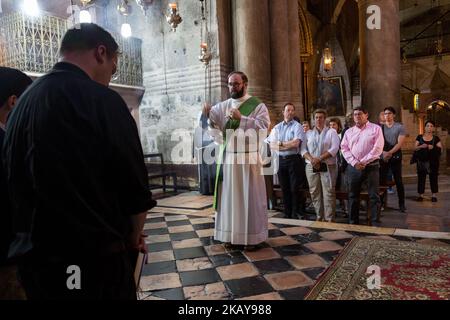 Roman Catholic monks hold a Mass in front of the Edicula, place ...