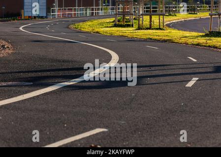 Curvy bike and walking path aling a road Stock Photo - Alamy