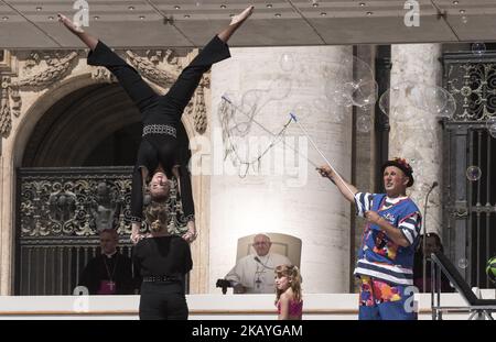 Pope Francis observes the spectacle of the aquatic circus, during the ...