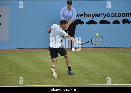 Bosnia and Herzegovina's Damir Dzumhur returns the ball to France's Giovanni Mpetshi Perricard ...