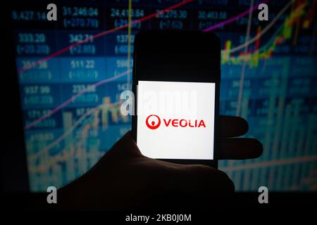 In this photo illustration, a Veolia logo is seen displayed on a ...