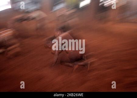Indian man (Pehlwan) practice Kushti a form of wrestling at a taleem ...