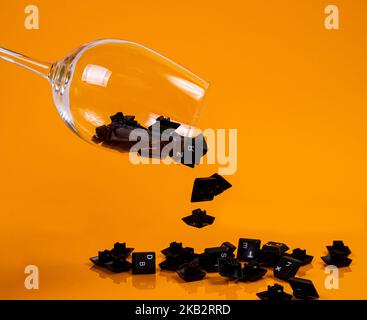 keyboard button in glass in jar in bucket on orange background isolated ...
