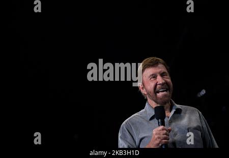Chuck Norris makes a presentation during Baptista Aid charity event on ...