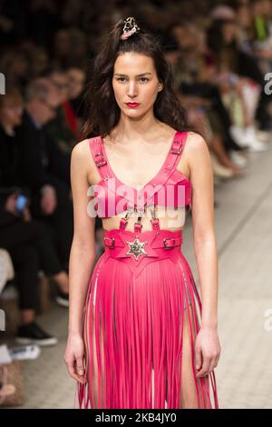 A model walks the runwayat Marina Hoermanseder Fashion Show during ...