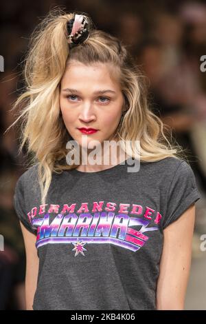 A model walks the runwayat Marina Hoermanseder Fashion Show during ...