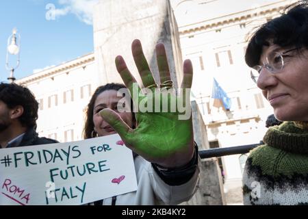 A protester protests against the inefficiency of policies on climate ...